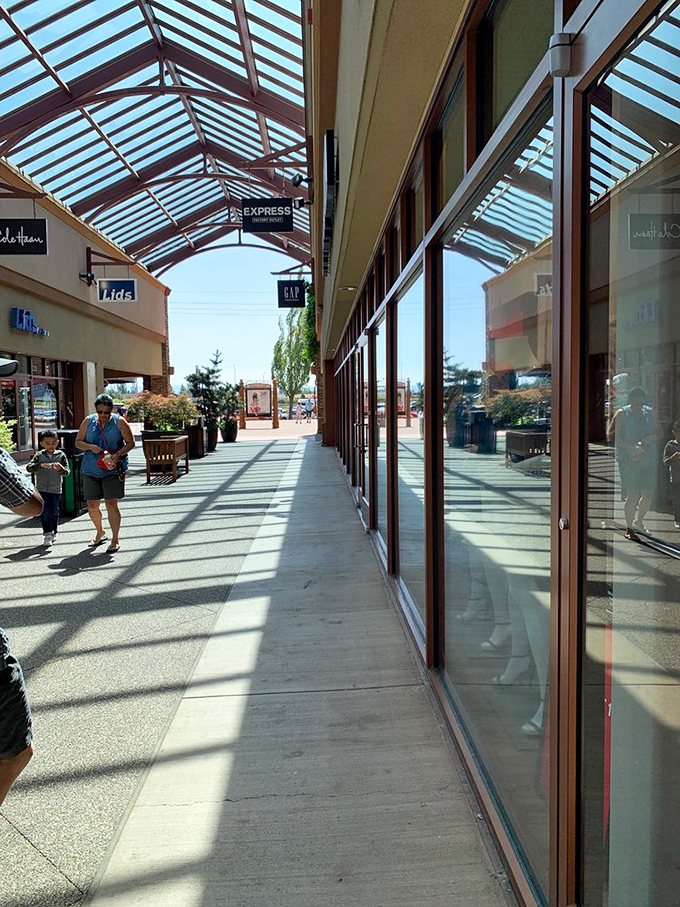 Sun-dappled walkways create the perfect ambiance for the shoppers' parade &ndash; a runway show where the models carry shopping bags instead of designer clutches.
