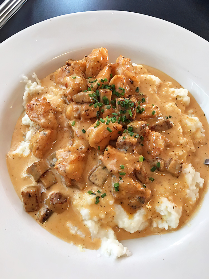 Shrimp and grits so creamy they should require a permission slip. Those plump gulf shrimp are taking a luxury swim in buttery heaven.