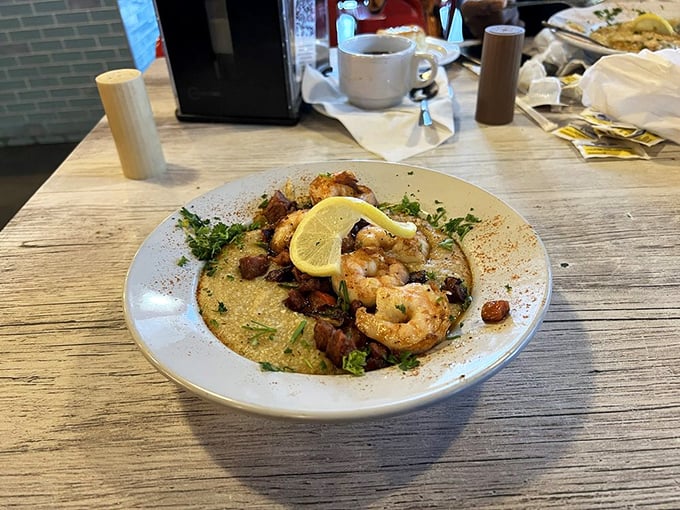 Creamy grits cradle perfectly seasoned shrimp in this Southern classic. The lemon wedge isn't just garnish&mdash;it's the bright note that ties it all together.
