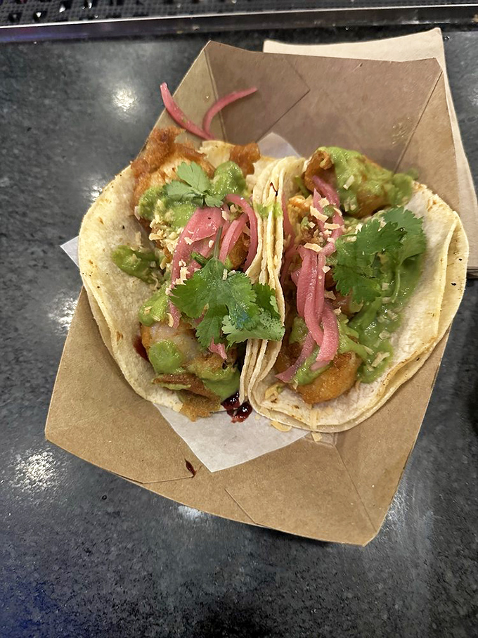 Tacos that look like they just stepped off a photo shoot. That orange sauce isn't just pretty&mdash;it's the flavor equivalent of finding an extra twenty in your pocket.