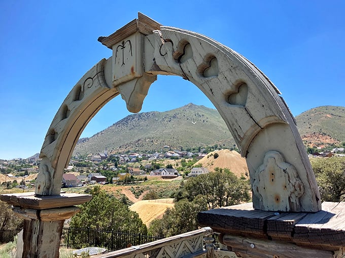 This decorative arch frames a view of Virginia City that feels straight out of an old Western, complete with rugged hills and historic rooftops.
