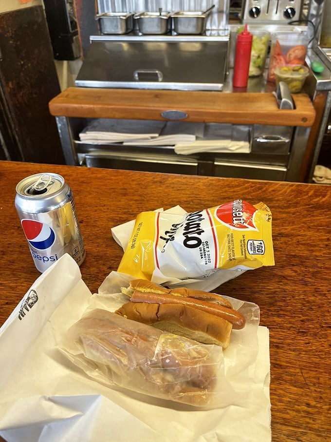 The lunch combo that launched a thousand memories. A steamed dog, chips, and a cold Pepsi&mdash;sometimes perfection needs no improvement.