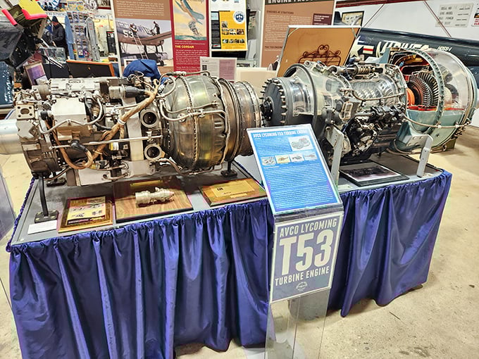 The Avco Lycoming T53 turbine engine sits like industrial sculpture. This mechanical marvel powered helicopters through decades of service with surprising elegance.