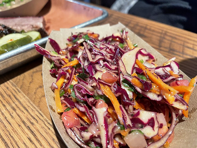 Not your grandmother's coleslaw (unless she was from Terlingua). This vibrant, confetti-like creation brings crunch, color, and attitude to the party.