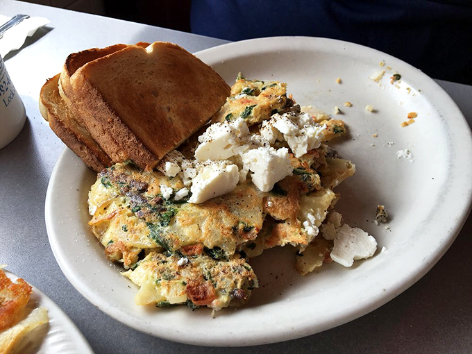 A table spread that would make your cardiologist wince and your soul sing. That cinnamon roll is practically winking at you. 