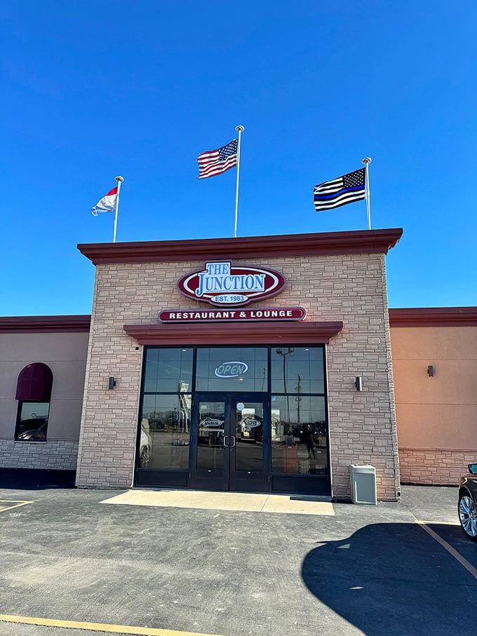 The Junction serves as Perry's gathering spot, where locals swap antique-hunting tips over hearty meals beneath a trio of fluttering flags.
