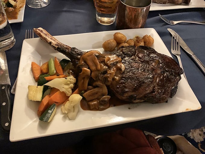 This isn't just a steak&mdash;it's a primal experience with a bone handle. Mushrooms, vegetables, and potatoes play supporting roles to this magnificent meaty masterpiece.