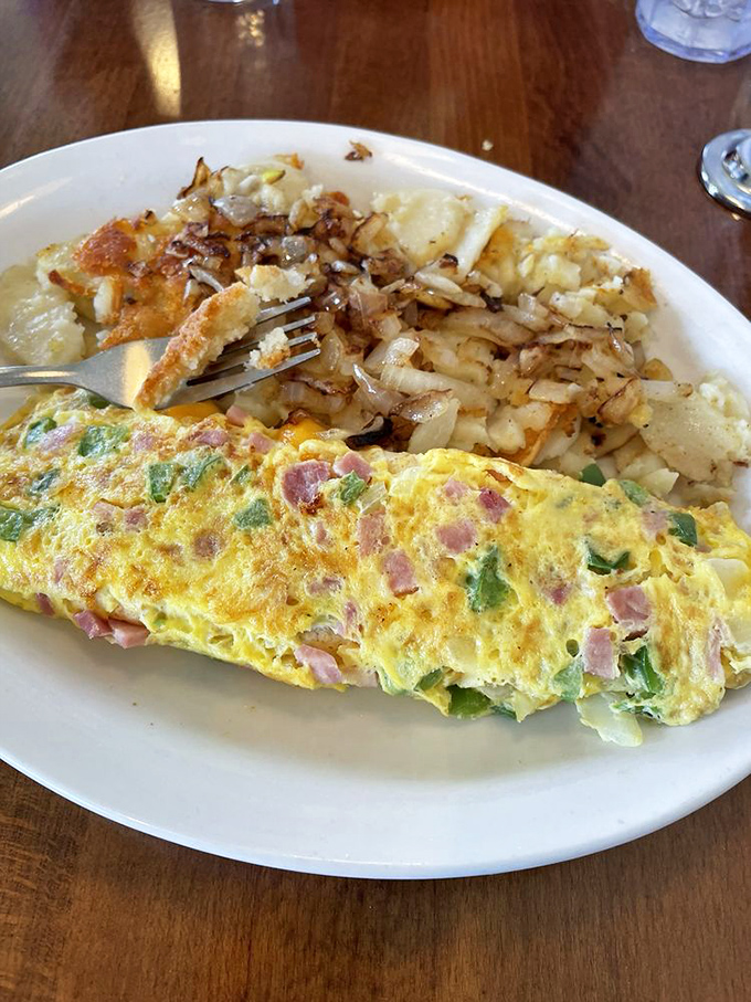 Western omelet and home fries—breakfast's dynamic duo, fighting the crime of morning hunger with eggy, hammy, peppery superpowers.