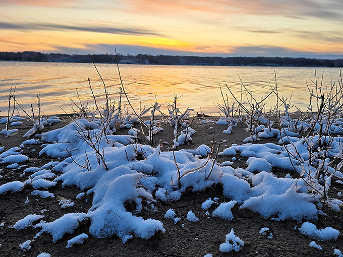 Winter transforms Long Branch into a snow-dusted wonderland. The sunset still performs, but now over a landscape dressed in its seasonal best.
