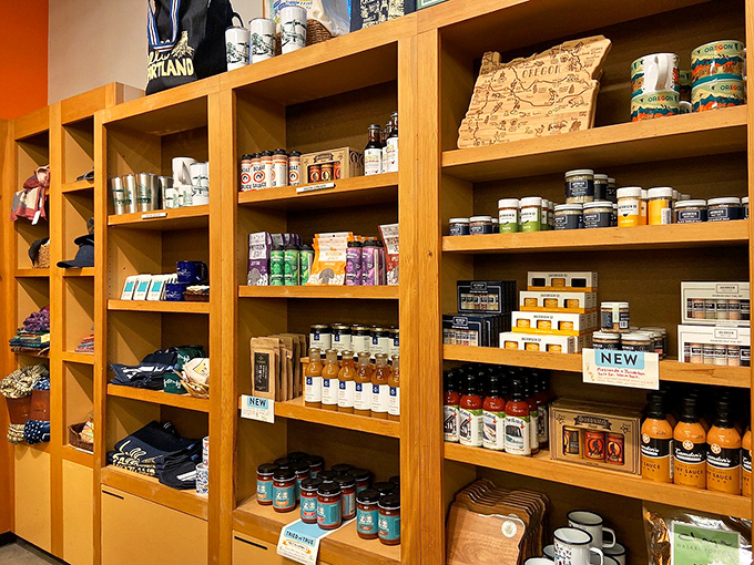 Powell's merchandise wall: where book lovers proudly display their tribe. These totes are the bibliophile equivalent of concert t-shirts.