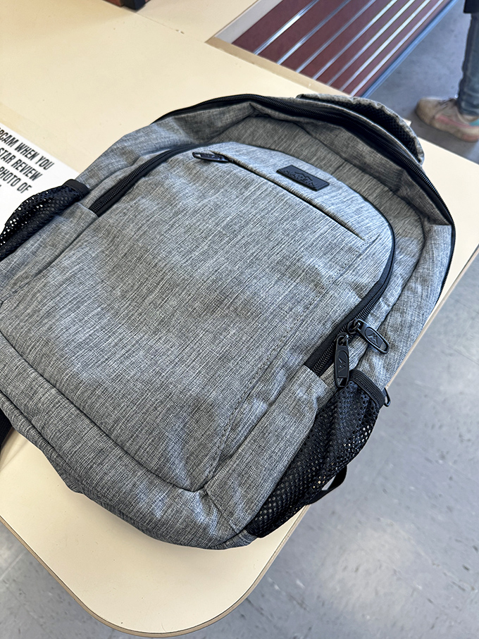 That stylish gray backpack isn't just practical—it's the perfect blend of function and fashion for the modern treasure hunter's next adventure.