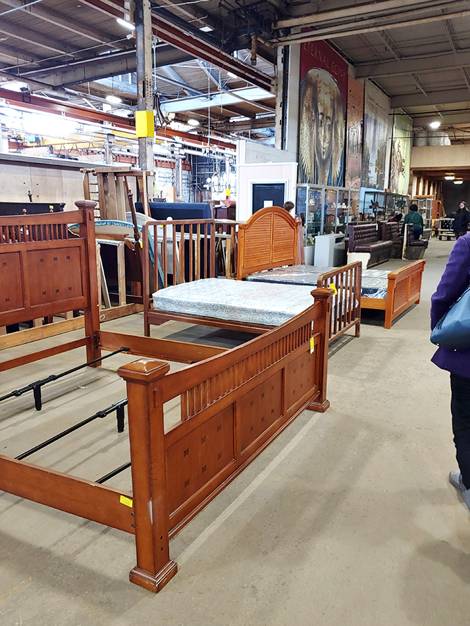 Bedroom furniture lined up with military precision, each piece silently promising better sleep and more stylish morning complaints.