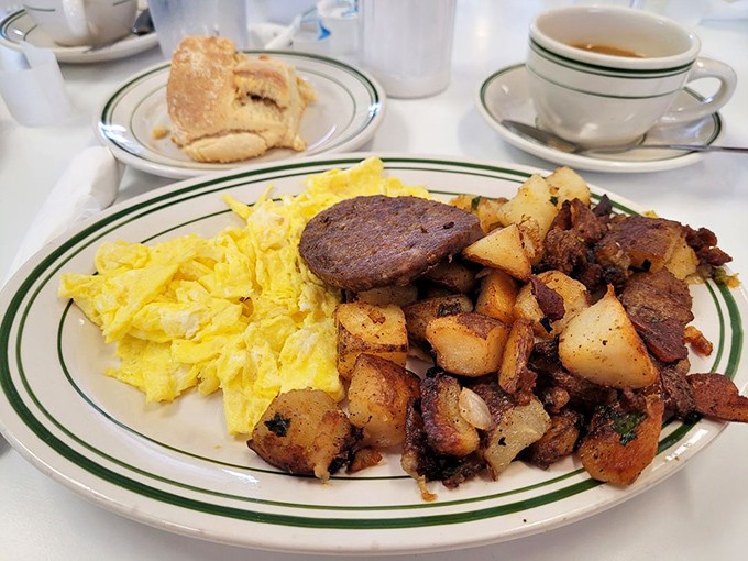 A breakfast plate that says, "You won't need lunch today, champ." Those scrambled eggs have achieved that elusive perfect texture that home cooks dream about.