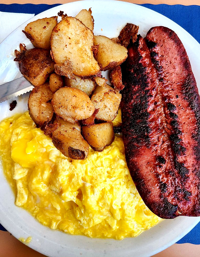 The breakfast trinity: scrambled eggs, home fries, and ham steak. Simple perfection that would make your grandmother nod in approval.