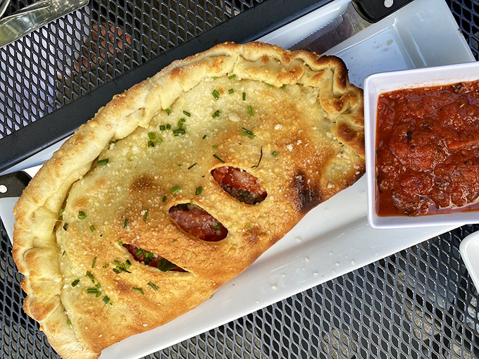 Not all heroes wear capes&mdash;some wear golden, flaky crusts. This calzone is what happens when pizza decides to get all mysterious and tuck its treasures inside.