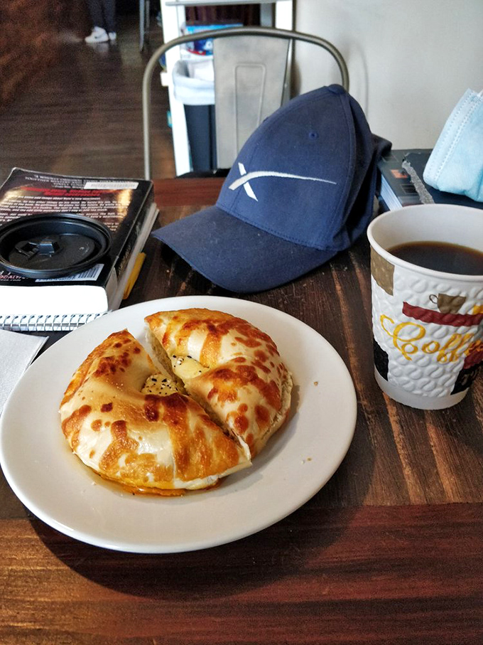 The breakfast of champions: toasty bagel with melty cheese alongside liquid motivation. A power duo that kickstarts any morning.