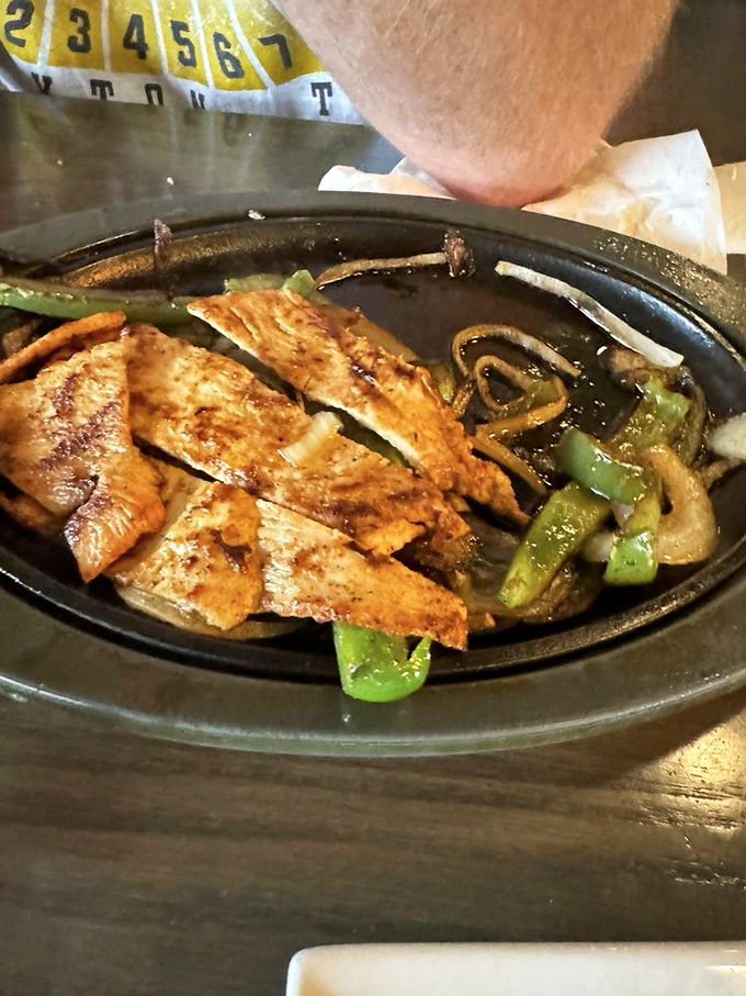 Sizzling chicken fajitas that announce their arrival with not just sound but an aroma that turns every head in the restaurant. Worth the spectacle.