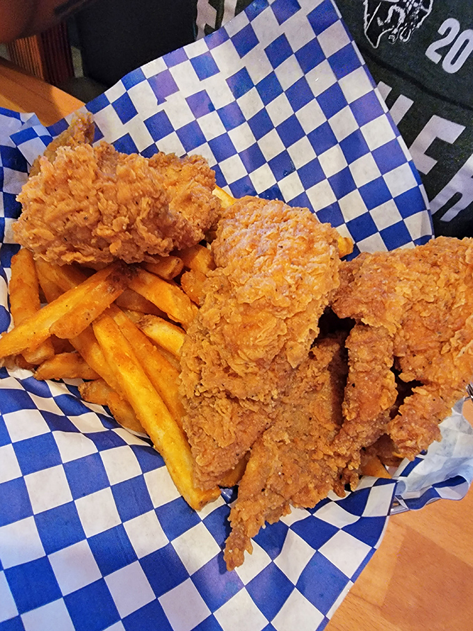 Fried chicken that's achieved the golden-brown perfection we all aspire to in life, served with fries that clearly got the same memo.