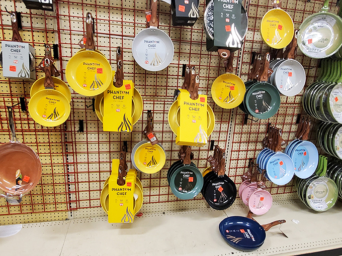 Colorful Phantom Chef cookware hangs like culinary jewelry, tempting home cooks with the promise of gourmet meals at fast food prices.