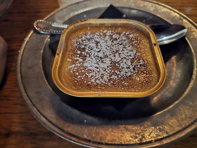 This cr&egrave;me br&ucirc;l&eacute;e doesn't just crack&mdash;it shatters with theatrical flair, revealing a custard so silky it makes velvet feel like sandpaper.