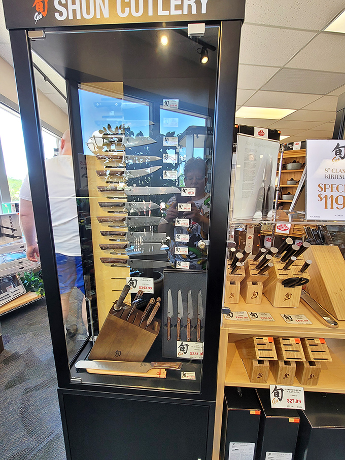 Shun Cutlery's gleaming knife display&mdash;where home chefs contemplate culinary greatness while their wallets contemplate early retirement.