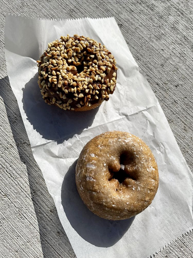 Chocolate, sprinkles, and nuts&mdash;oh my! This maple-frosted beauty isn't just a donut; it's therapy you can eat with your hands.
