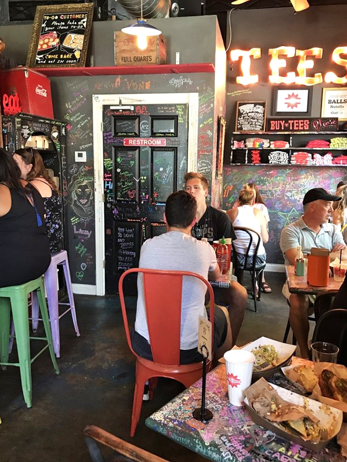 The colorful chairs match the colorful conversations happening around them in this cozy space where strangers become temporary breakfast buddies.