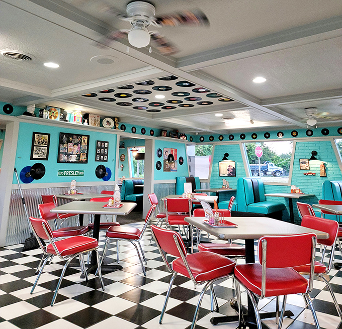 An interior designer's love letter to the 1950s, where every detail from the pendant lights to the turquoise walls screams authentic Americana.