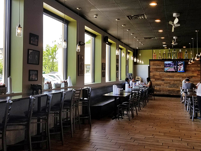 The dining area says "stay awhile" with its warm wood tones and mason jar lights &ndash; barbecue's natural habitat. 