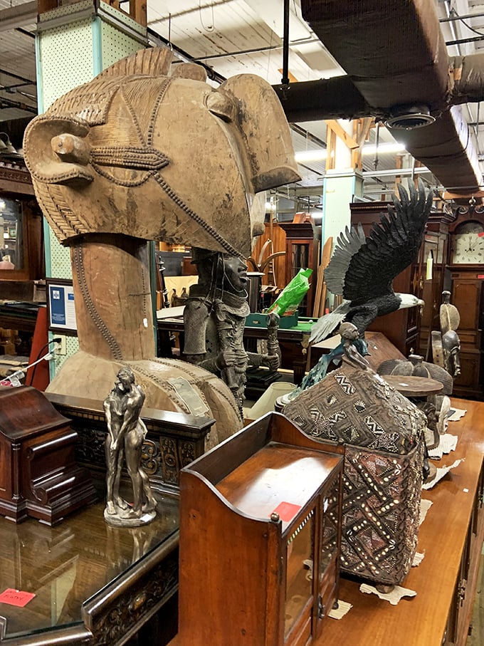 A safari of wood and wonder where carved elephants and eagles coexist with colonial desks. The Natural History Museum of furniture.