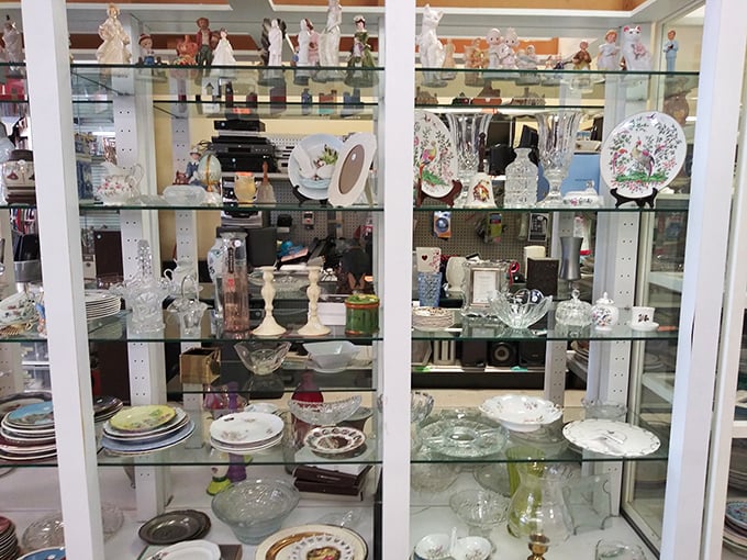 Behind glass doors, delicate treasures await new mantels to grace. One person's downsizing is another's upgrading.