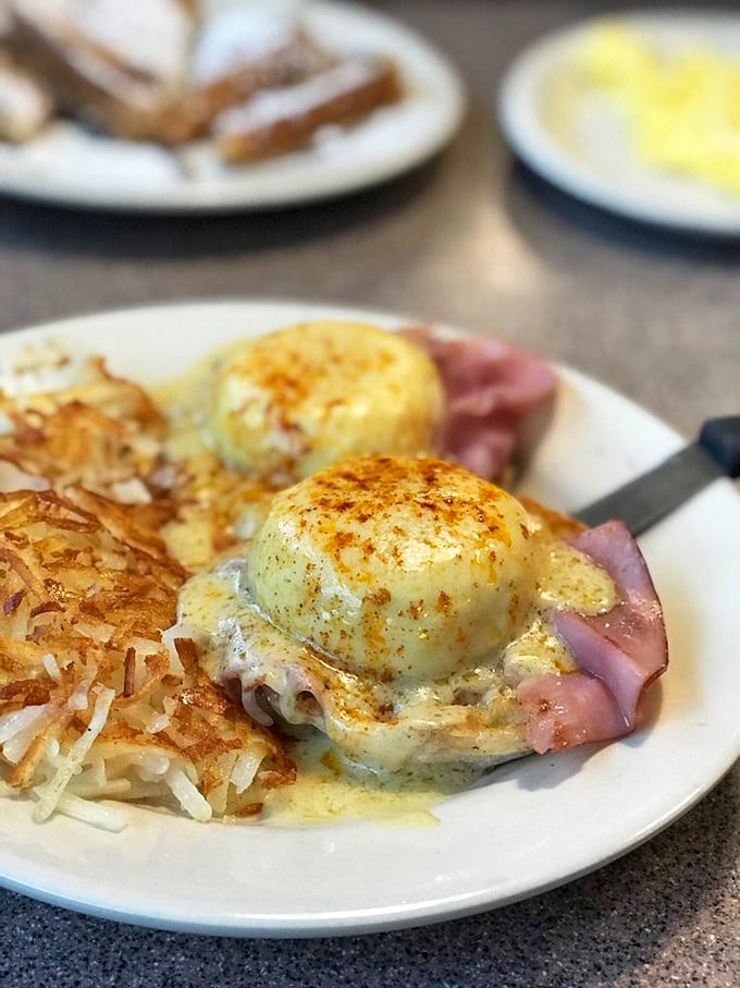 Eggs Benedict: where a perfectly poached egg sits atop ham like royalty on a throne, all crowned with hollandaise sunshine.