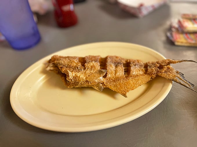 Fried fish so perfectly golden and crisp, it makes you wonder if they've somehow captured sunshine and coated it in cornmeal.