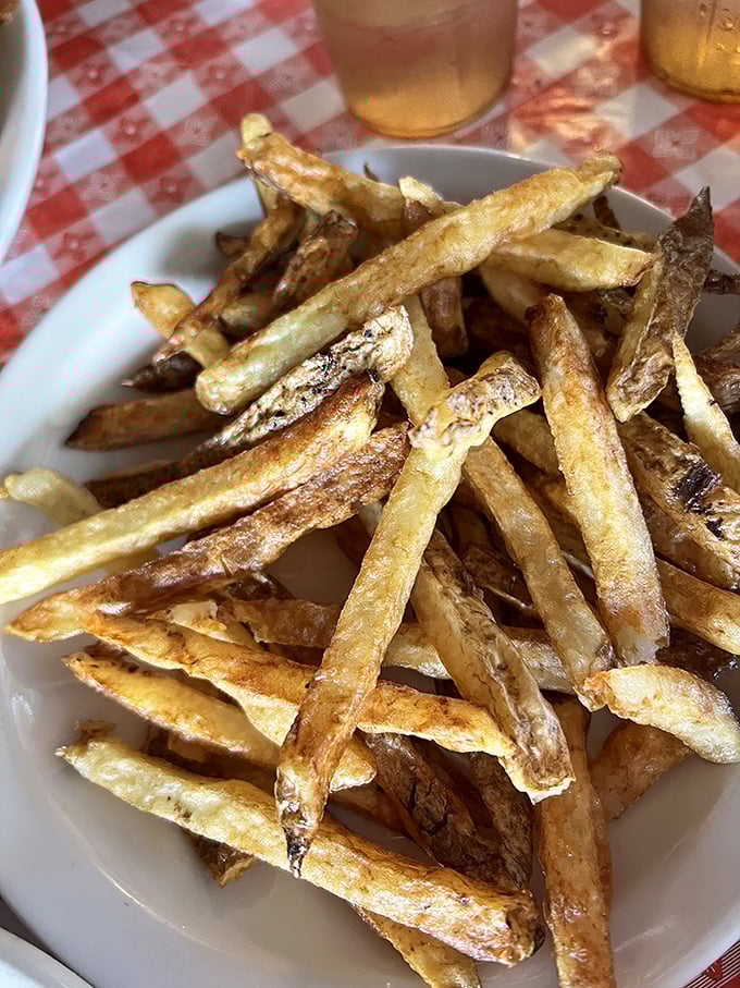 These aren't just french fries; they're golden wands of potato perfection that make you question why anyone would ever eat them any other way.