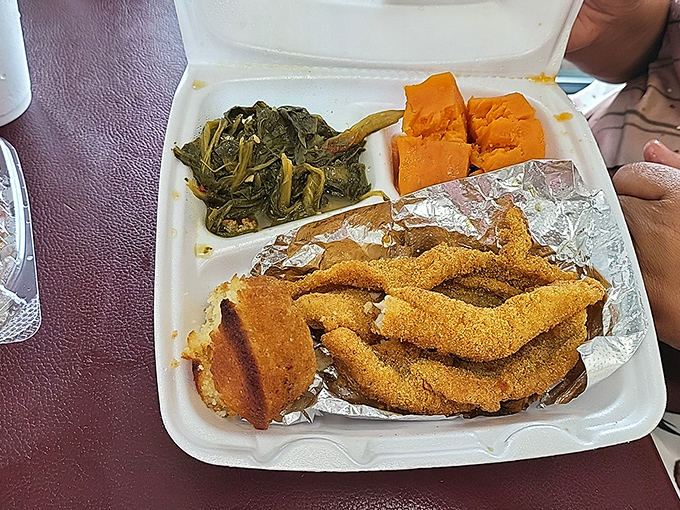 Golden-fried catfish strips that crunch like autumn leaves, with collards and sweet potatoes completing this Southern trinity of deliciousness.