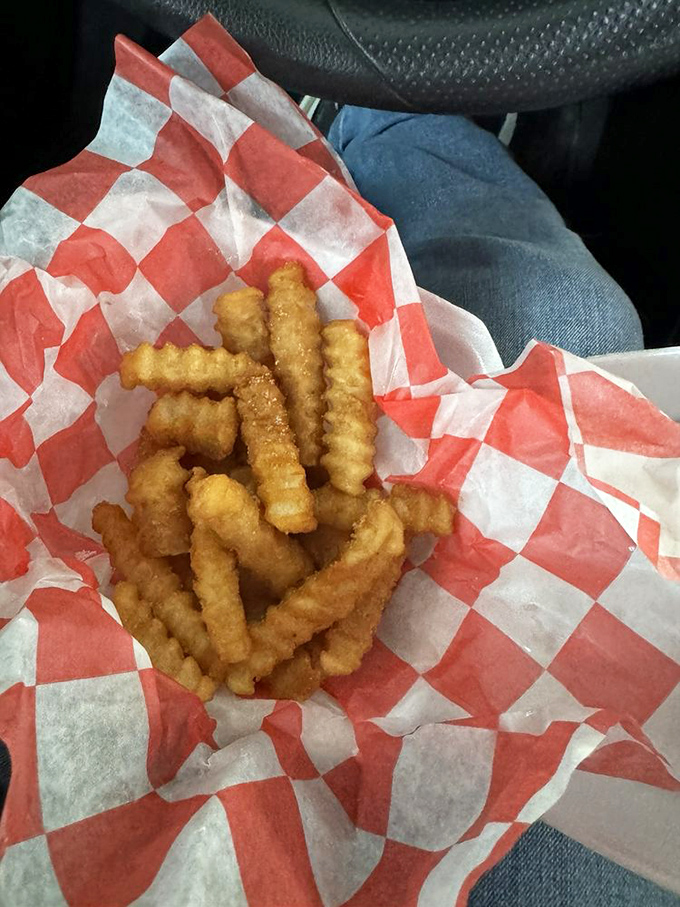 These golden crinkle-cut fries nestled in their checkered paper cradle aren't just a side dish&mdash;they're the supporting actors that deserve their own Oscar.