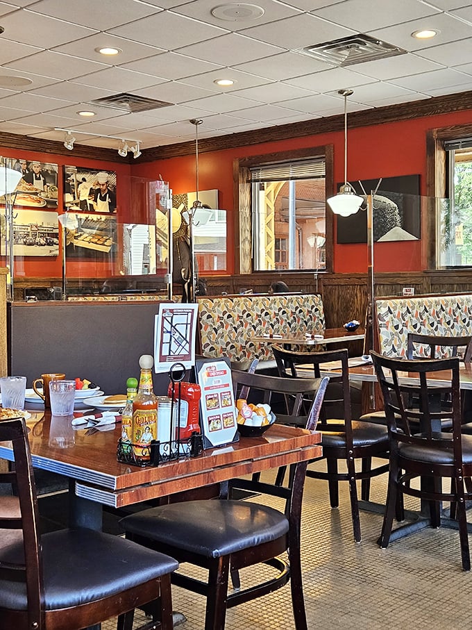 Red walls, patterned booths, and the promise of pancakes—this interior says "stay awhile" in the universal language of comfort.