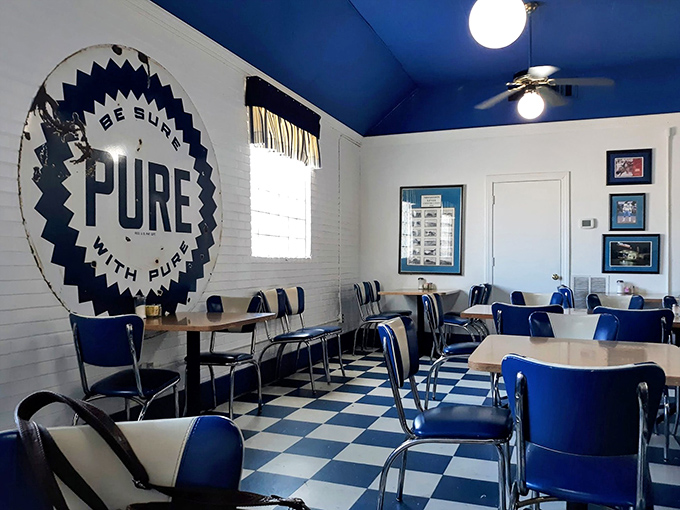 That vintage Pure Oil sign watches over diners like a blue and white guardian angel. The vaulted ceiling gives this humble diner unexpected grandeur.