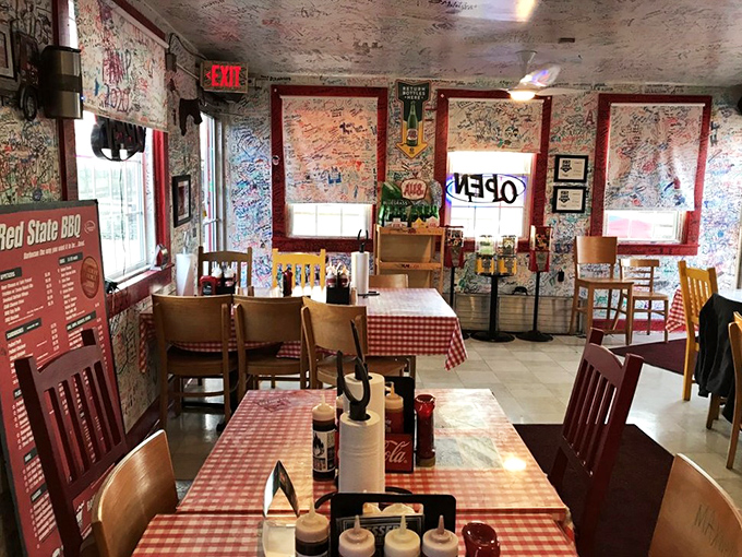 Red-checkered tablecloths and sauce bottles standing at attention, ready for the serious business of barbecue enjoyment.