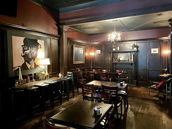 Dark wood, elegant lighting, and that painting watching over diners like a dapper guardian. The kind of room that makes everyday meals feel like special occasions.