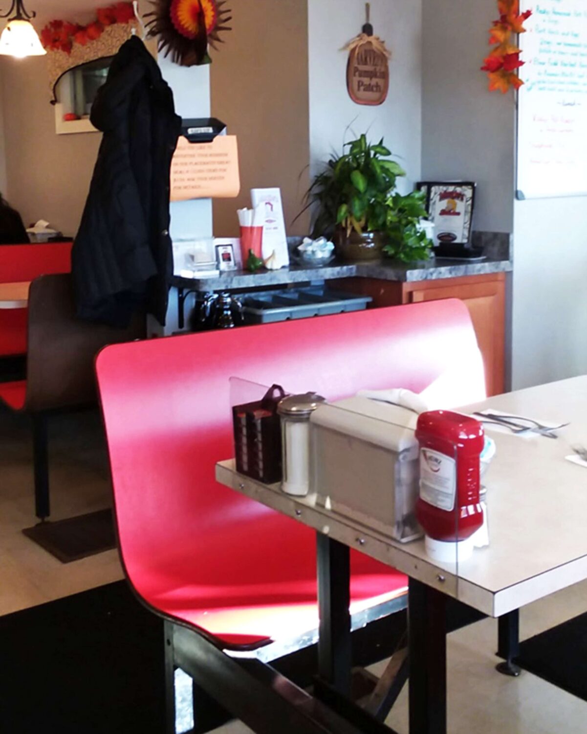 Red booths that have cradled generations of hungry patrons. The fall decorations remind you that seasons change, but good diners are eternal.
