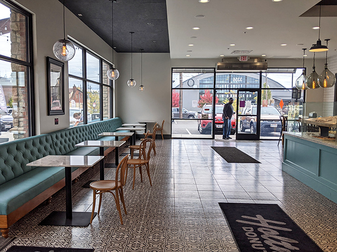Morning light streams through windows, illuminating what might be the world's most appetizing waiting area. Donut anticipation is its own pleasure.