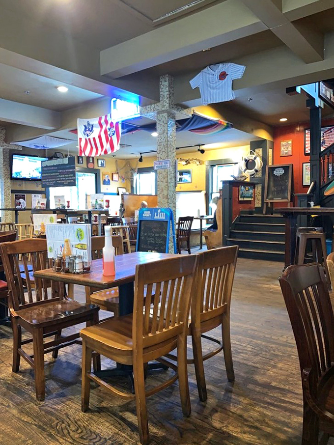 The restaurant's interior tells stories without saying a word. Sports memorabilia, nautical touches, and well-worn floors speak of countless happy meals.