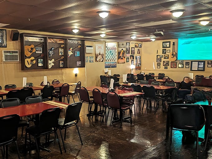 Red tables, black chairs, and walls covered in memories&mdash;a dining room that feels like your favorite uncle's basement, if he could really cook.