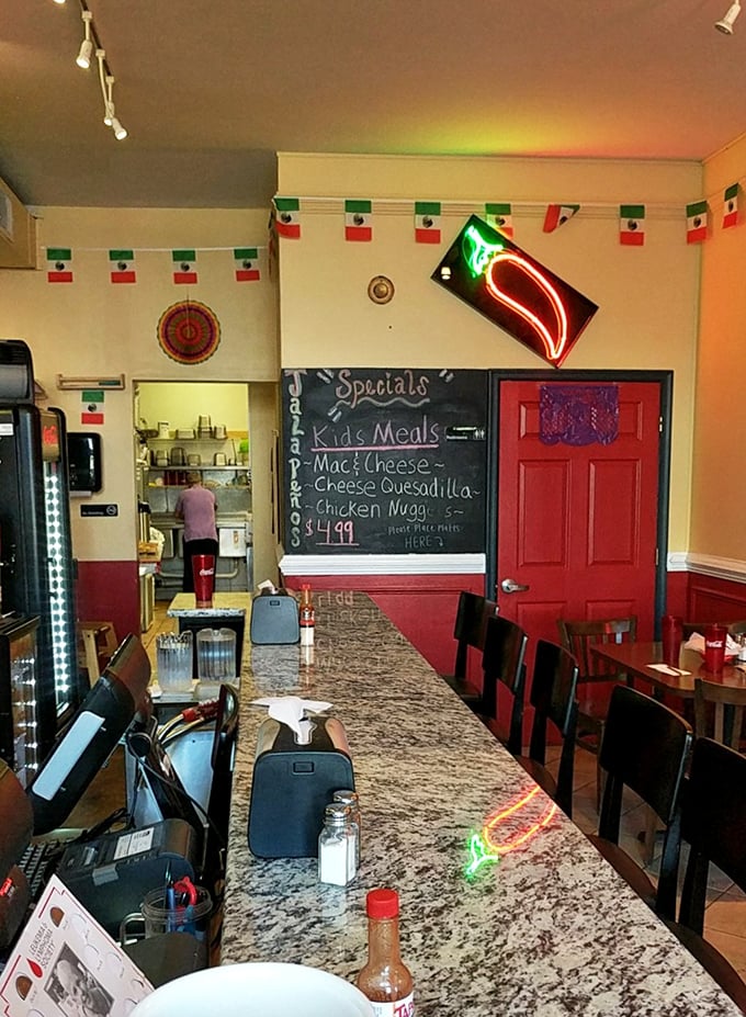 The neon jalape&ntilde;o sign and Mexican flag bunting aren't just decoration&mdash;they're a promise of the flavor fiesta awaiting inside.