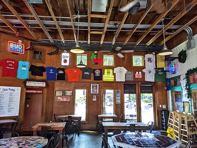 T-shirts on the wall tell stories of loyal customers, while the exposed ceiling keeps things casual in this beloved burger sanctuary.