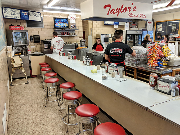 The counter staff orchestrates a delicious dance of efficiency, where every movement has been perfected through years of sandwich-making mastery.
