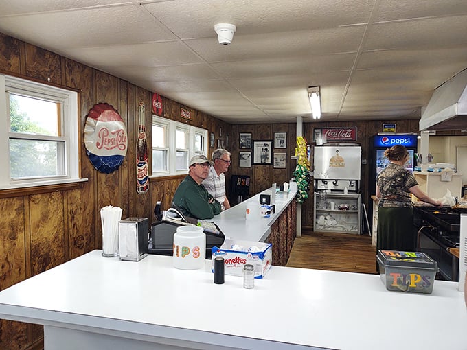 The counter view at Dovie's offers dinner and a show—watch as burger magic happens before your eyes in this wood-paneled time capsule.