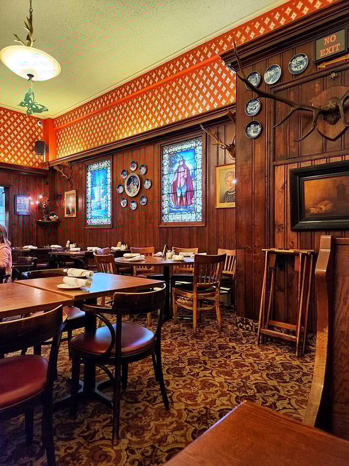 Stained glass windows and decorative plates transform ordinary walls into a museum of German culture where every corner tells a story.