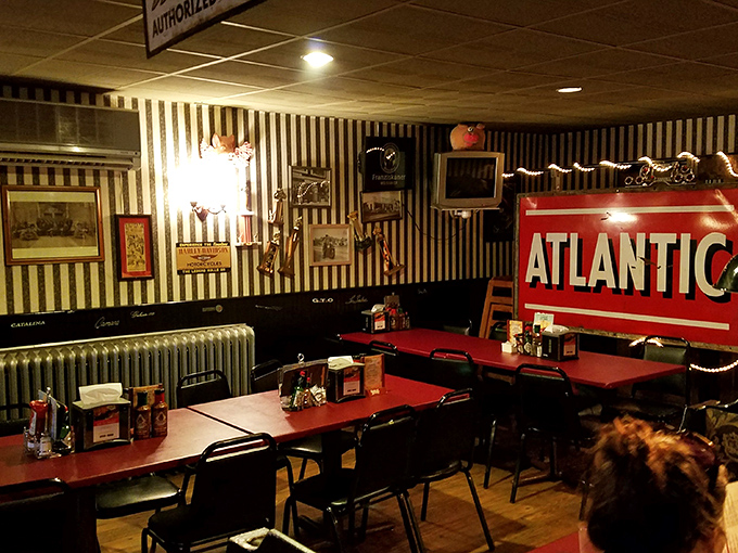 Black and white striped walls adorned with vintage memorabilia&mdash;this dining room feels like stepping into America's collective barbecue memory.
